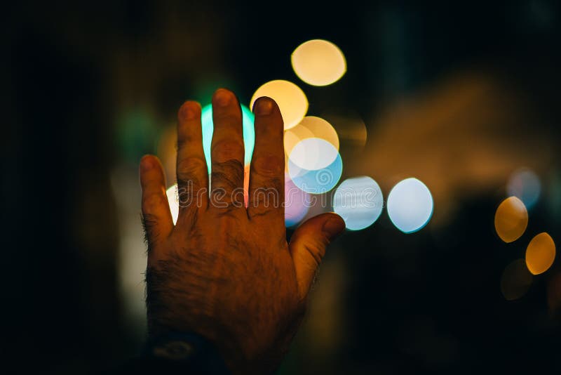 Man Hand Trying To Touch the Bokeh Light Stock Image - Image of bokeh ...