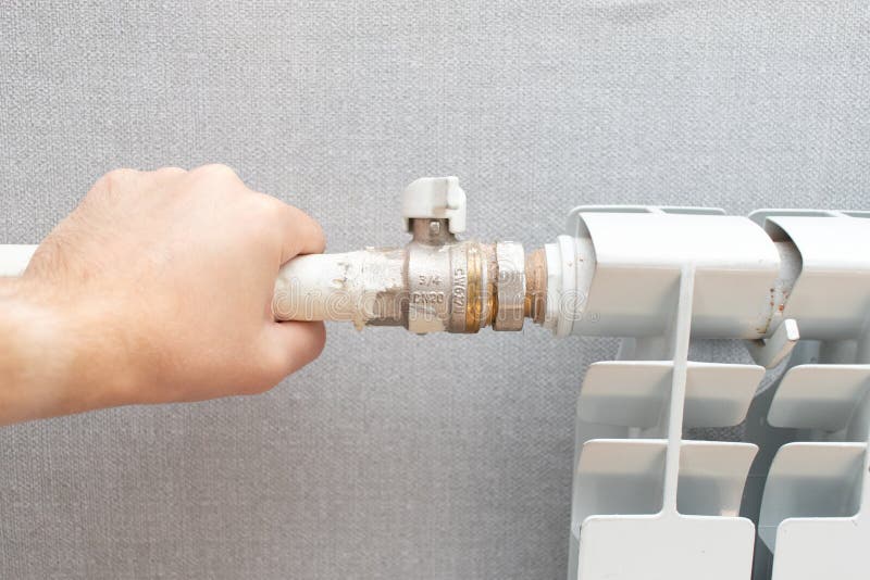 Man Hand on Turn Off Valve of White Radiator Check Temperature ...