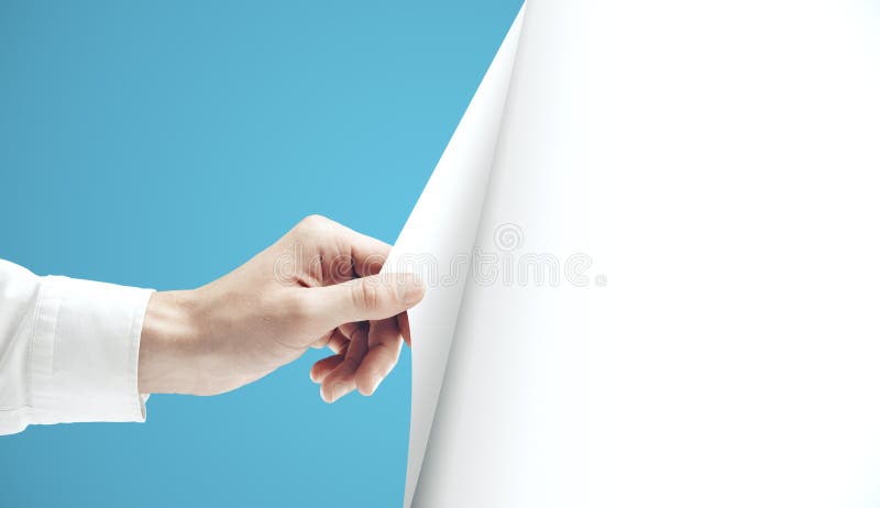 Man hand turning blue page stock photo. Image of communicate - 172005610