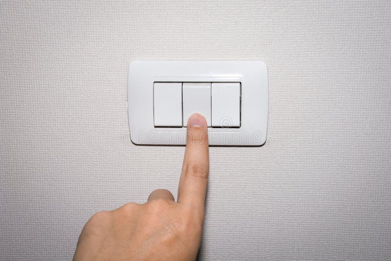 Man Hand is Turning on or Off Electrical Light Switch Stock Photo ...