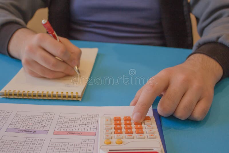 Man Hand Using Calculator, Accounting Concept. Man Hands with Pencil ...