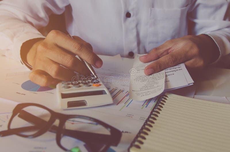 Man Hand Using Calculator with Calculate Bills and Financial Dat Stock ...