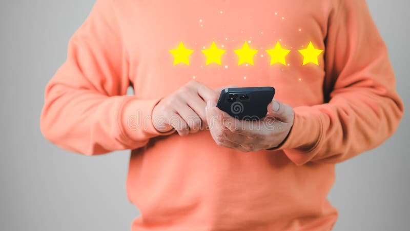 Man Hand Using a Mobile Phone with Popup Five Star Icon for Feedback ...