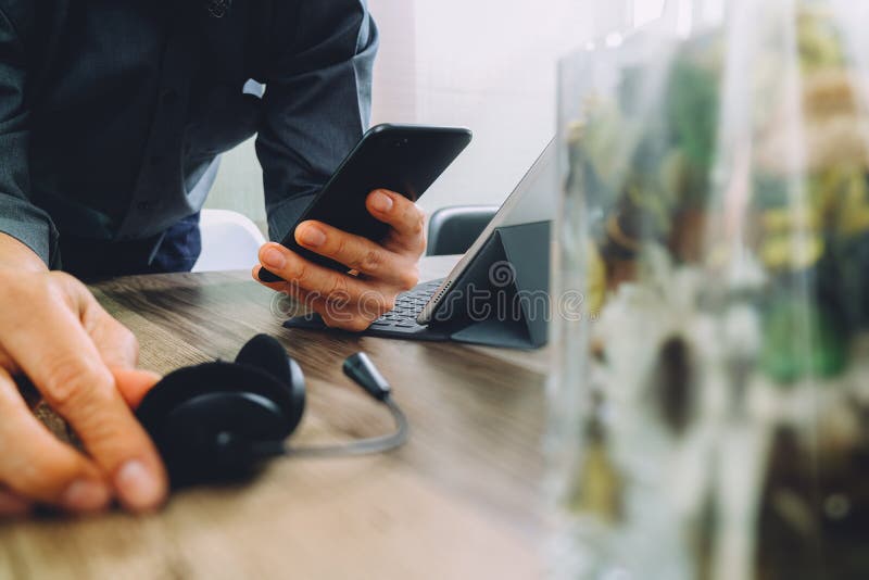 Man Hand Using VOIP Headset with Digital Tablet Computer Docking Stock ...
