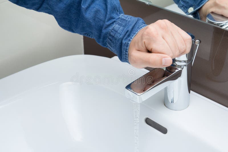 Man hand on water tap stock image. Image of clear, person - 79052291