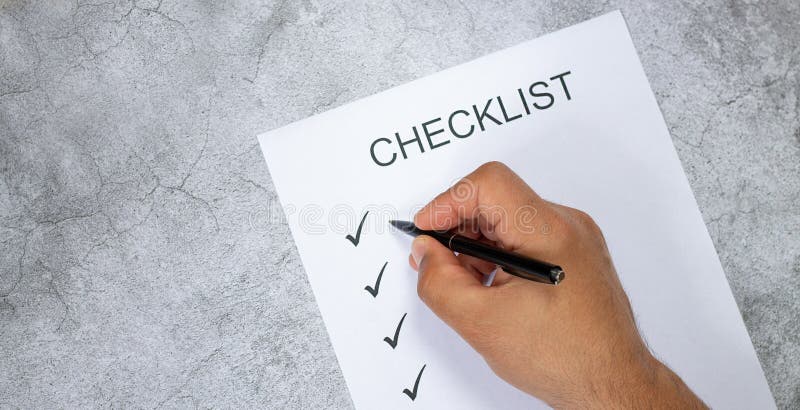 Man Hand Writing on Checklist with Black Pen on Stone Desk Stock Image ...