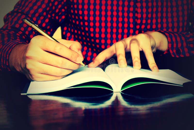 Man Hand Writing on Notebook on Desk in Home. Stock Image - Image of ...