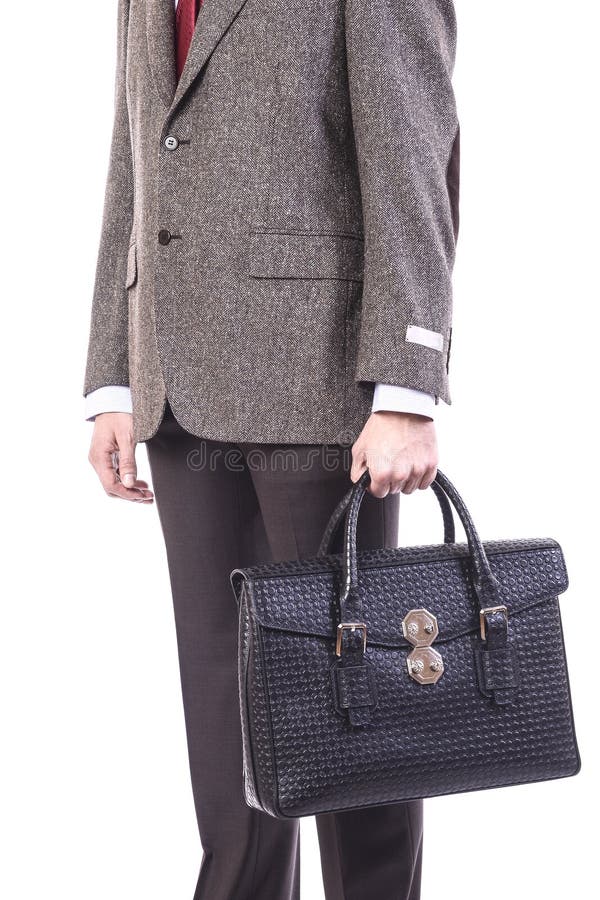 A Man with a Handbags in His Hand Stock Photo - Image of background ...