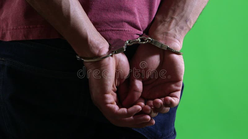 Man with handcuffs stock footage. Video of arrest, chain - 257824746