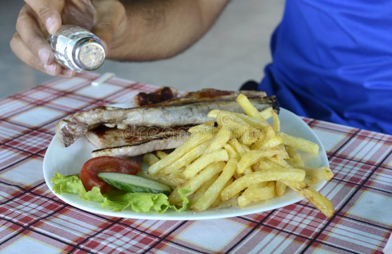 Man Hands Adding Salt To the Meal at the Cafe Stock Image - Image of ...