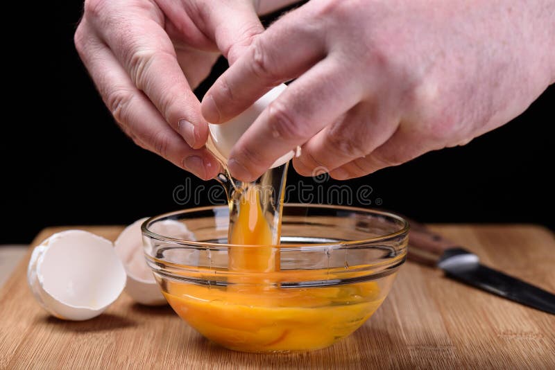 Man Hands Breaking an Egg Egg Shells at the Cutting Board Stock Image ...