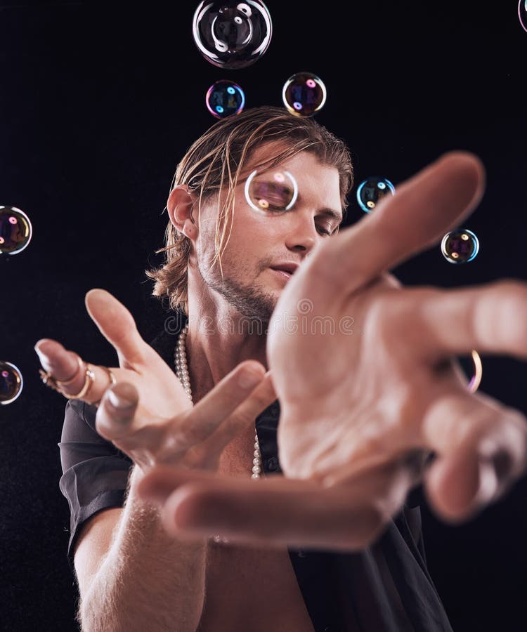 Man, Hands and Bubbles in Studio for Magic, Art Performance or Creative ...