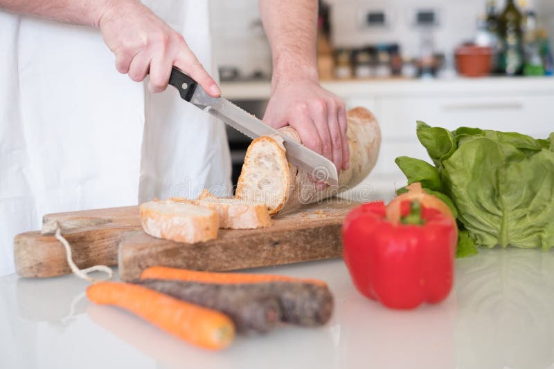 Man Hands Cutting Bread Slices in the Kitchen Stock Image - Image of ...