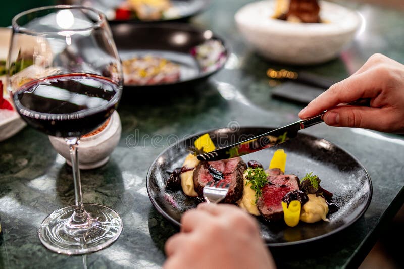 Man Hands Eats Meat in a Restaurant Stock Image - Image of dinner ...