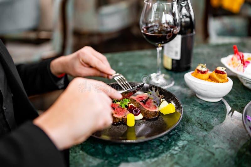 Man Hands Eats Meat in a Restaurant Stock Image - Image of male ...