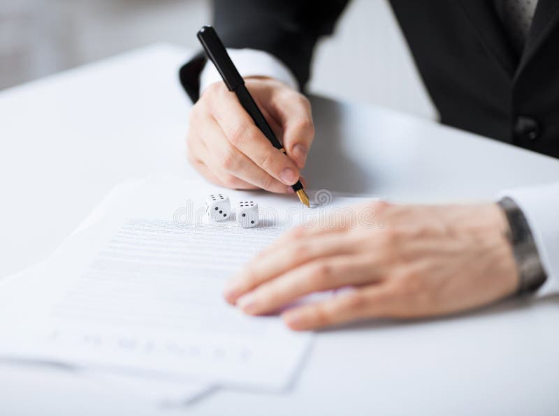 Man Hands with Gambling Dices Signing Contract Stock Image - Image of ...