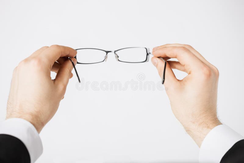 Man Hands Holding Eyeglasses Stock Image - Image of business, medicine ...