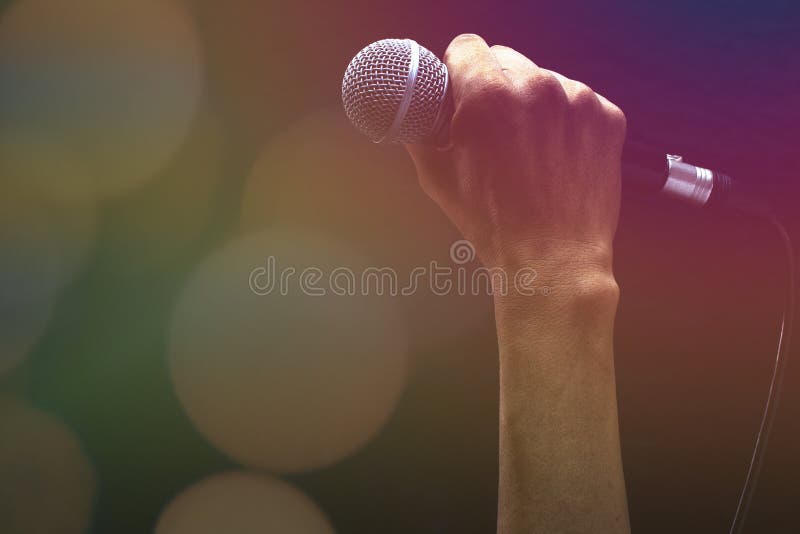 Hand Holding a Microphone on a Stand Stock Photo - Image of microphone ...