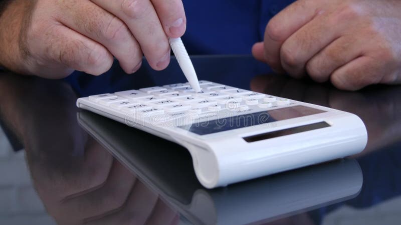 Man Hands Image on the Desk Calculating Using a Pen and Adding Machine ...