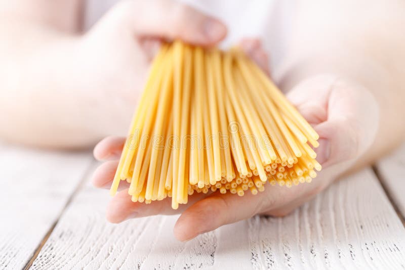 Man Hands in the Kitchen Holding Spaghetti Stock Photo - Image of ...