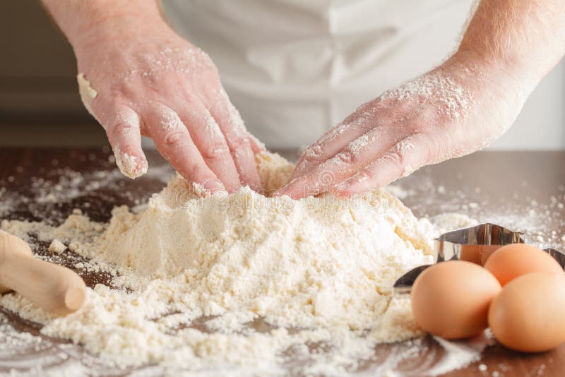 Man hands kneading a dough stock image. Image of kneading - 78572229