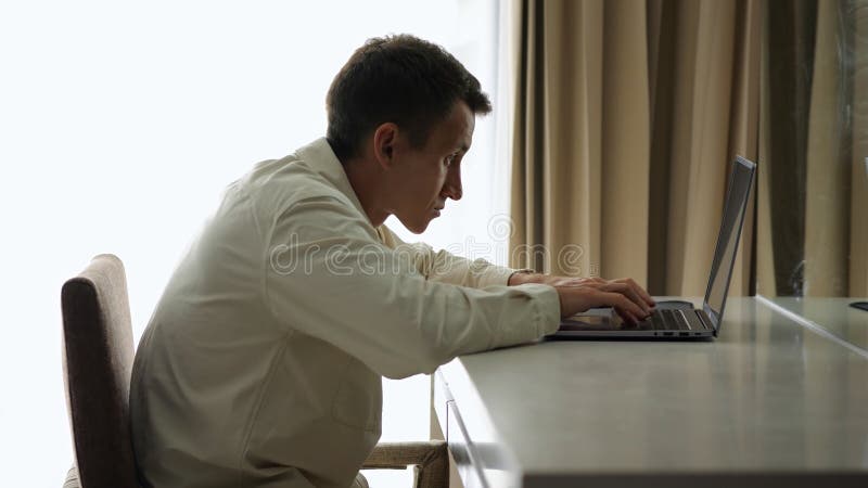 Man Hands Move Rapidly on Keyboard while Eyes Fixed on Screen Stock ...
