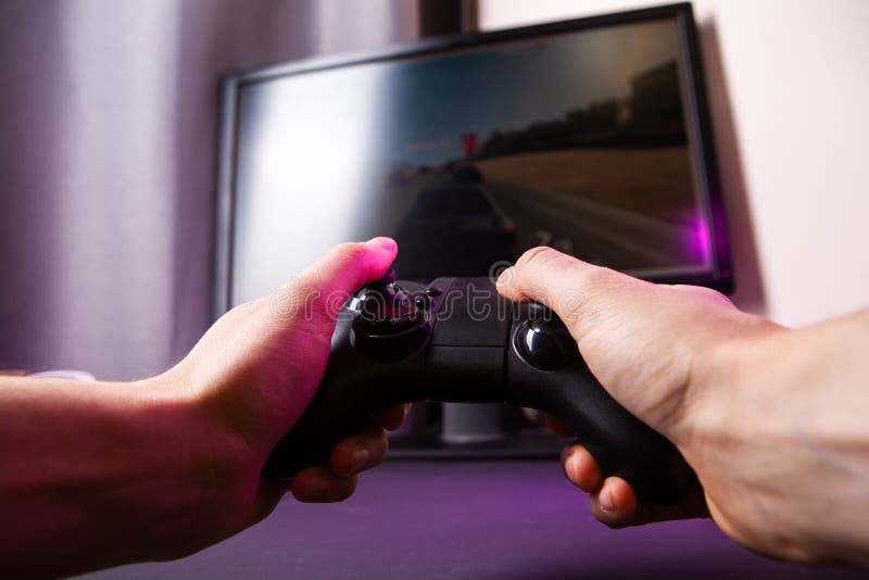 Man Hands Playing a Computer Game with a Game Joystick. Stock Photo ...