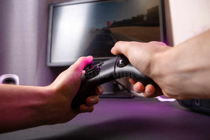 Man Hands Playing a Computer Game with a Game Joystick. Stock Photo ...