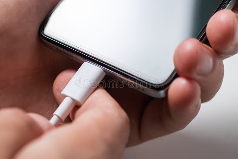 Man Hands Plugging a Charger in a Smart Phone Stock Photo - Image of ...