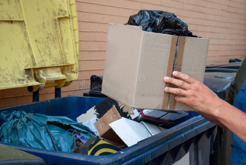 Man Taking Out Big Paper Box on Trash into Garbage Container. Stock ...