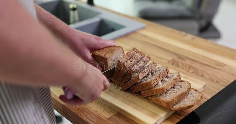 Man Hands Slice Loaf of Bread on Cutting Board Using Knife Stock Video ...