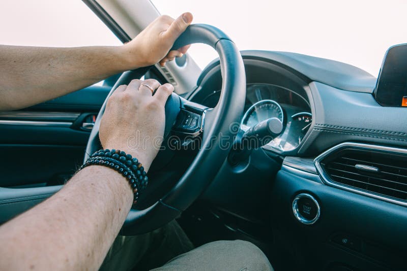 Man Hands on Steering Wheel Stock Photo - Image of road, modern: 219814320