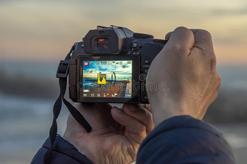 Man Hands Taking a Photograph with DSLR of Sunset Landscape Stock Image ...