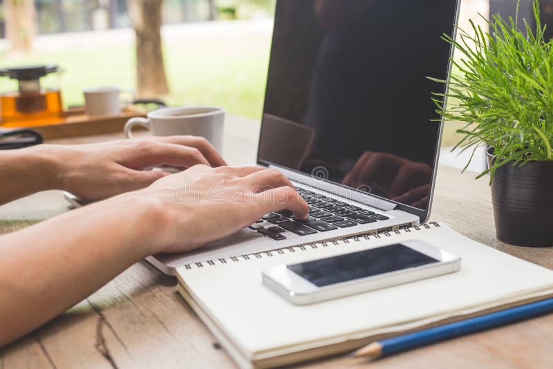 Man Hands Typing Laptop Computer in Coffee Shop. Stock Photo - Image of ...