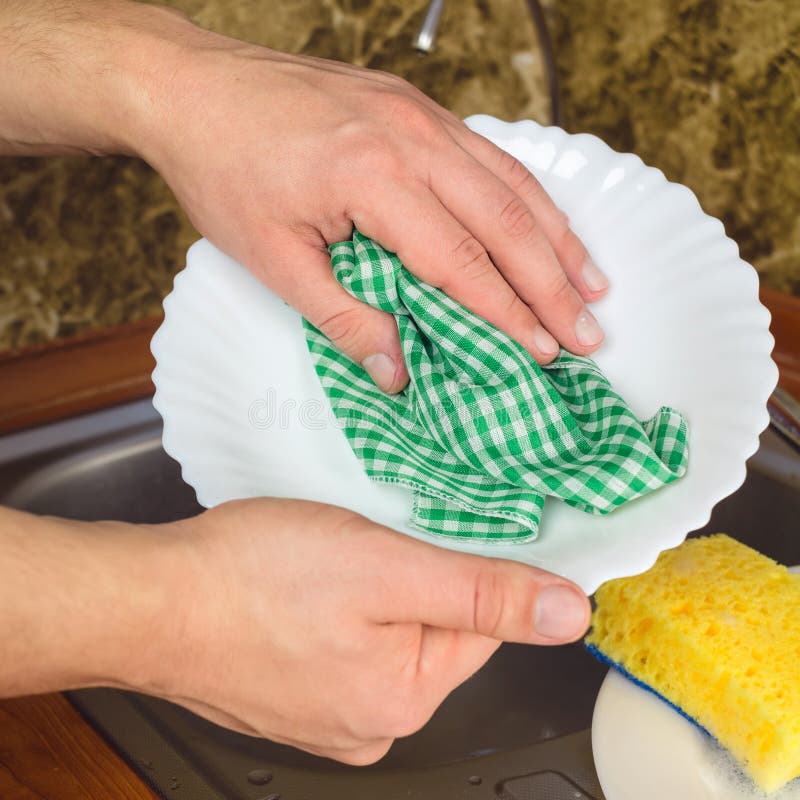 Man Hands Wipe with Towel Clean White Dish at the Kitchen. Stock Image ...