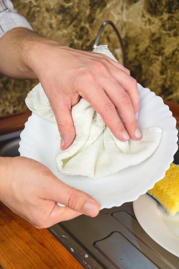 Man Hands Wipe with Towel Clean White Dish at the Kitchen. Stock Photo ...
