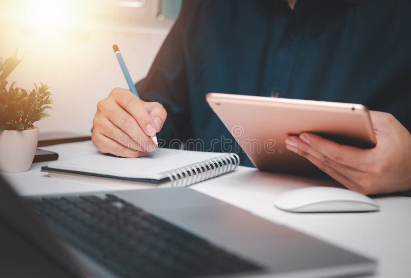 Man Hands Writing Goals, Plans, and Wish List on Notebook in Office ...