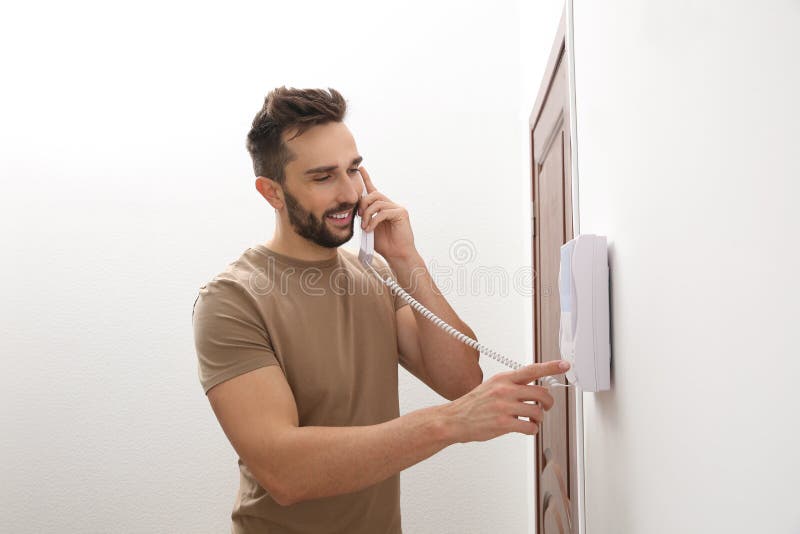 Man Answering Door Stock Photos - Free & Royalty-Free Stock Photos from ...