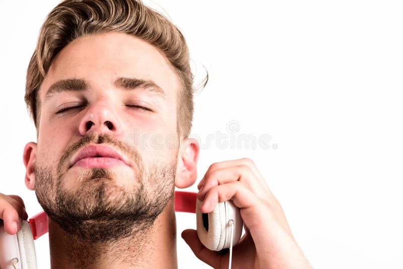 Man Handsome Unshaven Hipster Listening Song Using Headphones Gadget