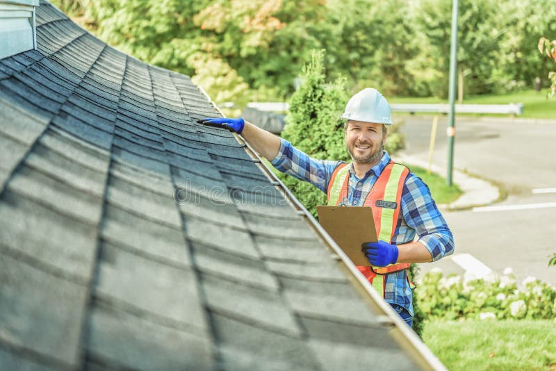 Man with Hard Hat Standing on Steps Inspecting House Roof Stock Image ...