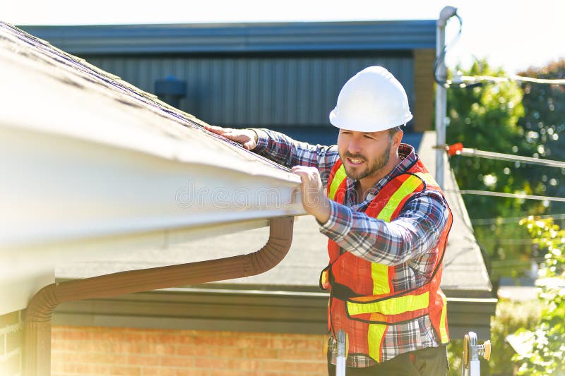 Man with Hard Hat Standing on Steps Inspecting House Roof Stock Image ...