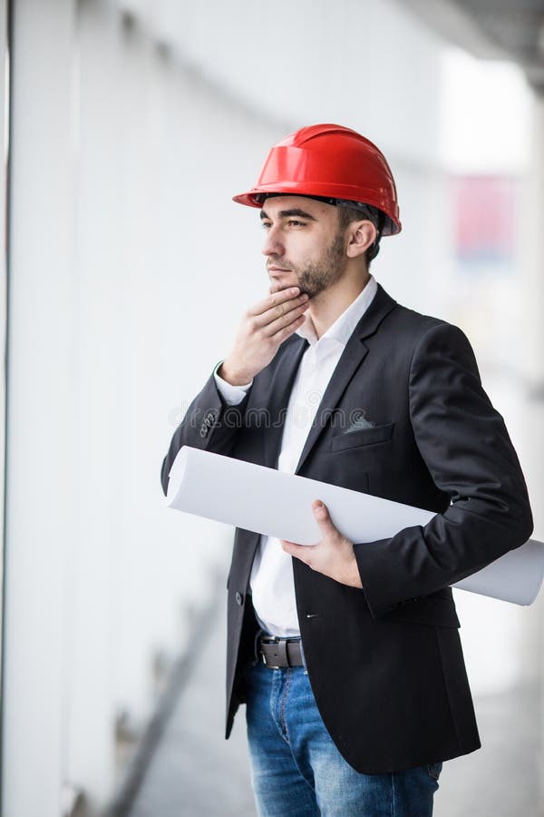 Man in Hard Hats at Building with Plans Thinking Stock Image - Image of ...