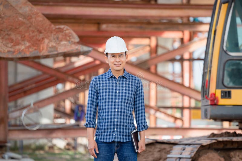 Man in Hardhat with Digital Tablet at Infrastructure Construction Site ...
