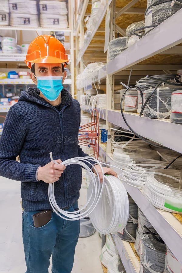 A Man in a Hardware Store. Sells Electrical Cables. Selective Focus ...