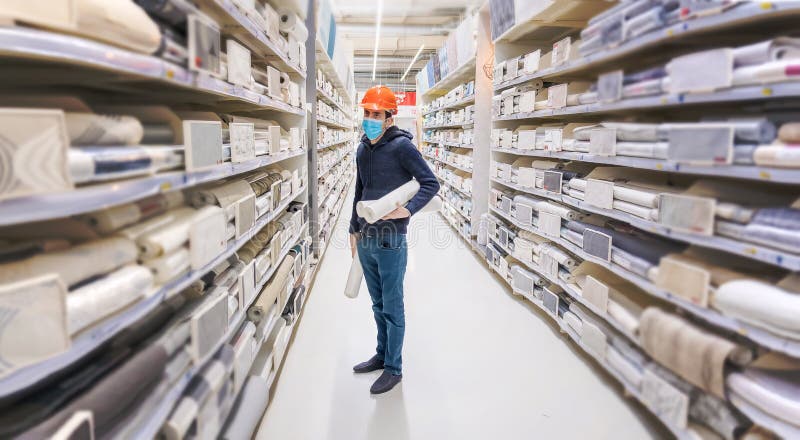 A Man in a Hardware Store. Wallpaper for Sale. Selective Focus Stock ...