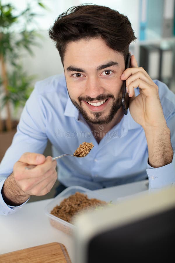 Man Has Business Lunch in Office Talking on Mobile Stock Photo - Image ...
