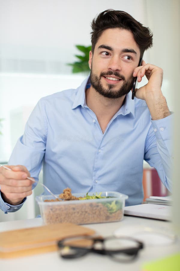 Man Has Business Lunch in Office Talking on Mobile Stock Image - Image ...