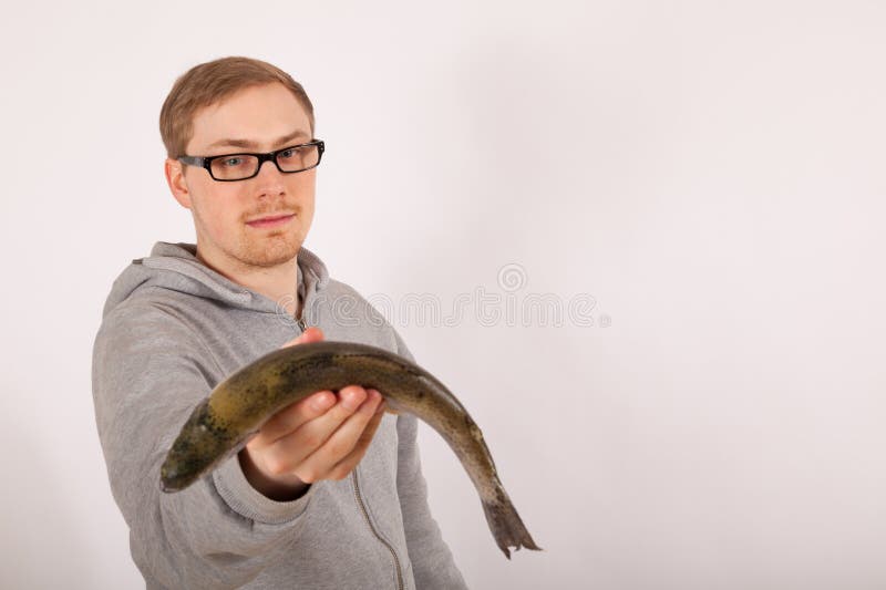 A Man Has a Fish in His Hand Stock Image - Image of purchase, natural ...