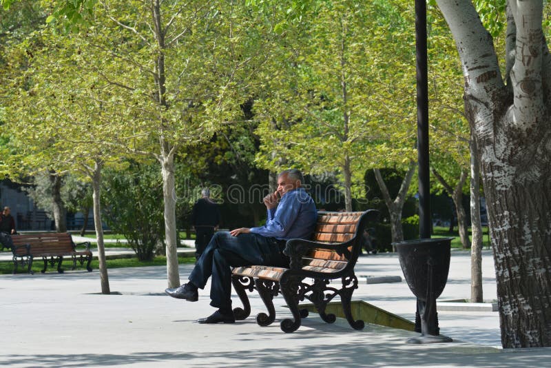 Man Has a Rest Sitting on Bench in Park Editorial Photo - Image of ...