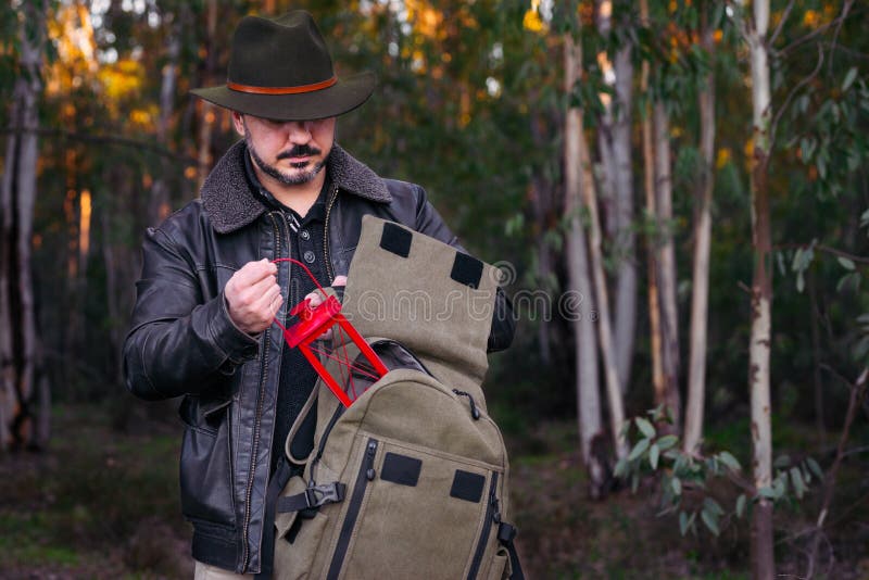 Man with Hat and Jacket Catching Old Backpack Lamp Stock Image - Image ...